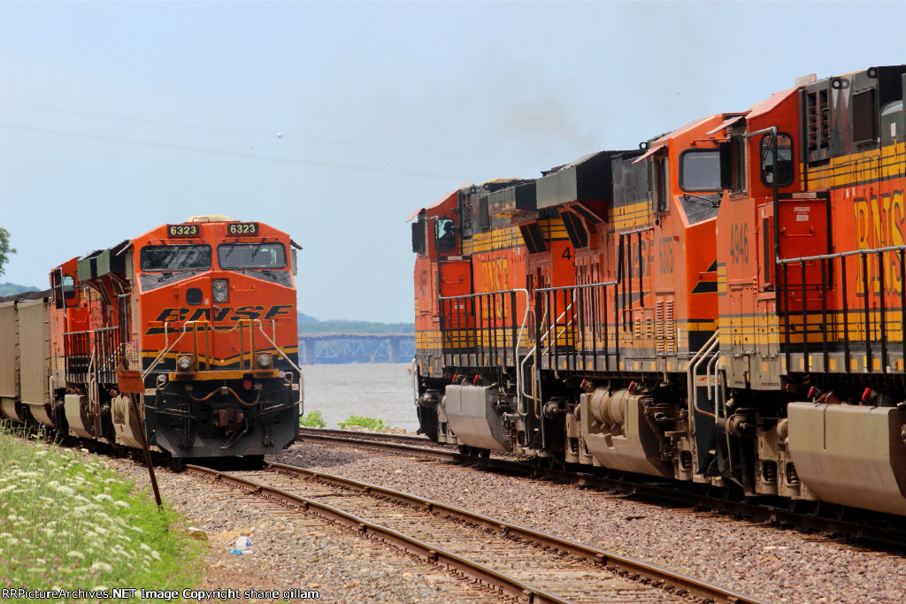 BNSF 6323 meets the nb ore train.